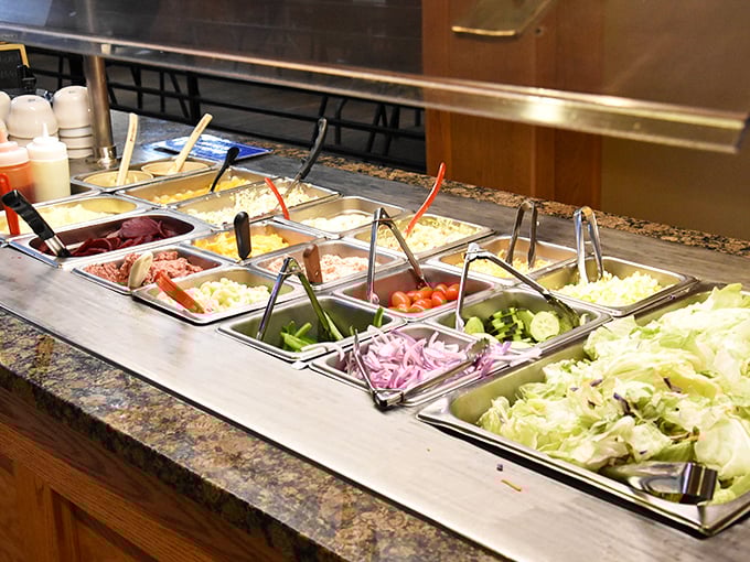 The fresh salad bar offers a moment of virtuous decision-making before inevitably ordering that tenderloin sandwich anyway.