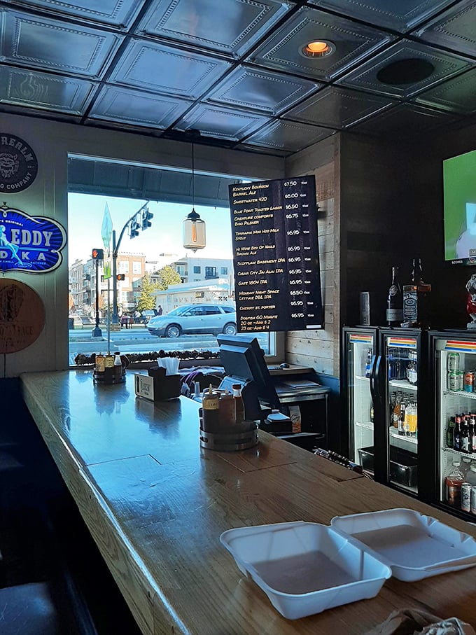 The service counter offers a glimpse of downtown Alpharetta through the window, reminding you there's a world outside this barbecue paradise.