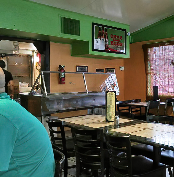 The service counter doubles as your view into where fresh seafood transforms into the stuff dreams are made of nightly.