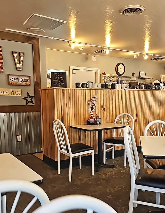 Farmhouse-style decor and wooden wainscoting create that "grandma's kitchen" feeling that makes every meal taste better. Note the "Gathering Place" sign&mdash;truth in advertising.