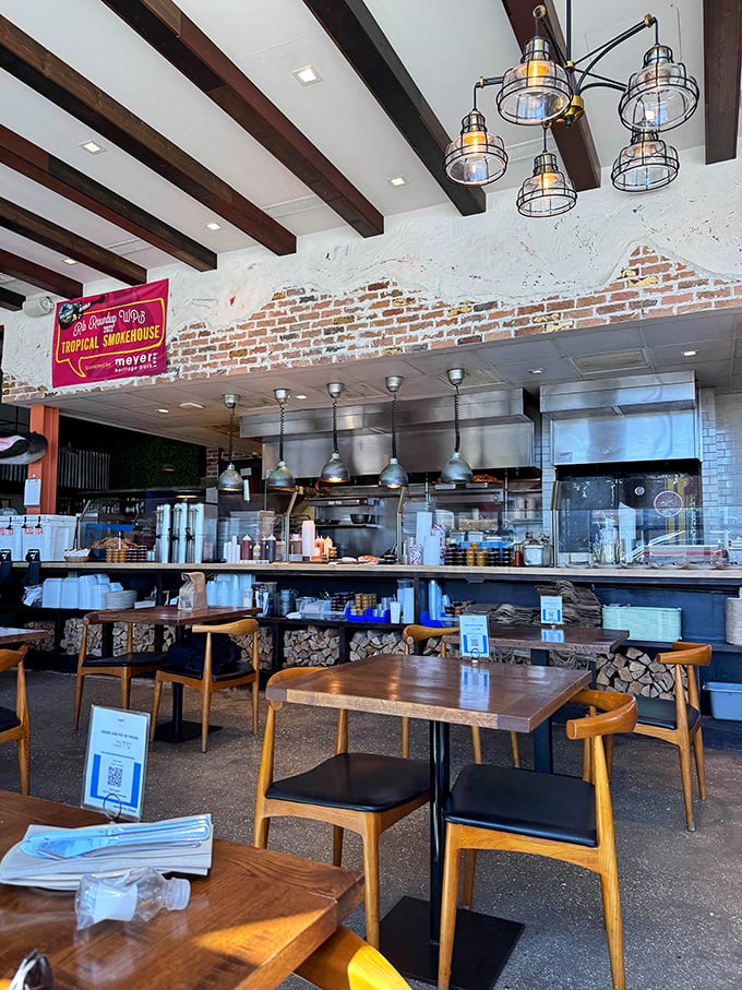 Where the magic happens. The open kitchen design lets you witness the choreography of Florida's BBQ revolution.