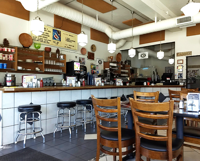 Vintage pendant lights and exposed ducts create that perfect "discovered gem" atmosphere that makes regulars out of first-timers.