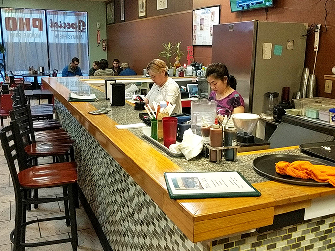 Behind the counter, staff work with practiced efficiency. This is the engine room of flavor, where Vietnamese culinary traditions come to life in Columbus.