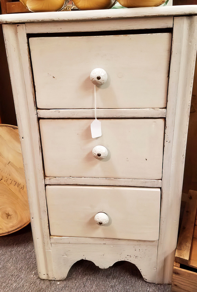 This shabby-chic three-drawer cabinet with ceramic knobs is begging to hold your bathroom essentials or bedside reading materials.