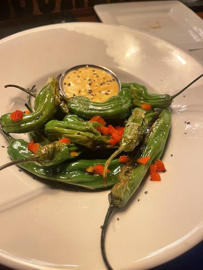 Blistered shishito peppers playing culinary roulette&mdash;most are mild, but occasionally one brings the heat. That dipping sauce is liquid gold worth its weight in actual gold.