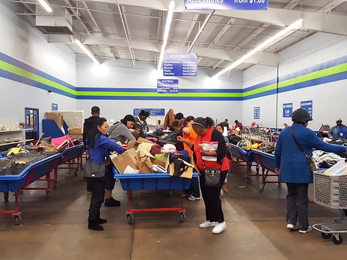Behind the scenes magic&mdash;where donations transform into retail-ready treasures. These blue-vested wizards sort through yesterday's belongings to stock tomorrow's finds.