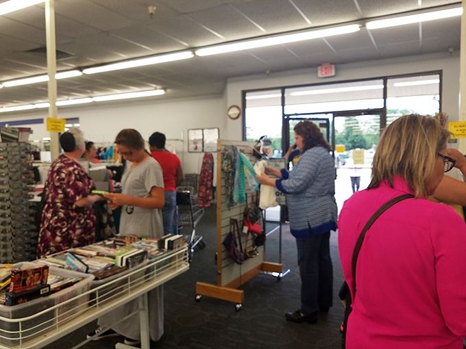 Real shoppers finding real treasures, because this isn't some staged photo shoot, it's Tuesday afternoon thrift store heaven.