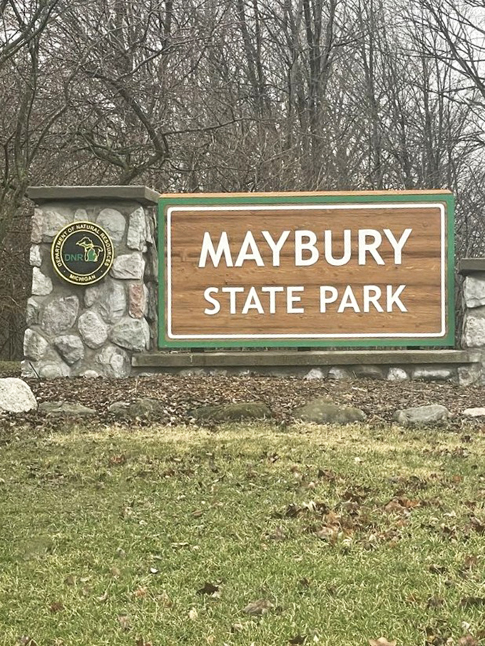 The gateway to unplugged adventures. This rustic sign marks the border between "checking emails" and "checking out wildlife" territory.