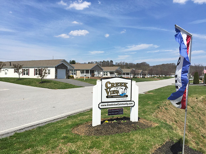 The gateway to simpler living. Creek View's welcoming sign promises exactly what many retirees seek: community, comfort, and countryside charm.