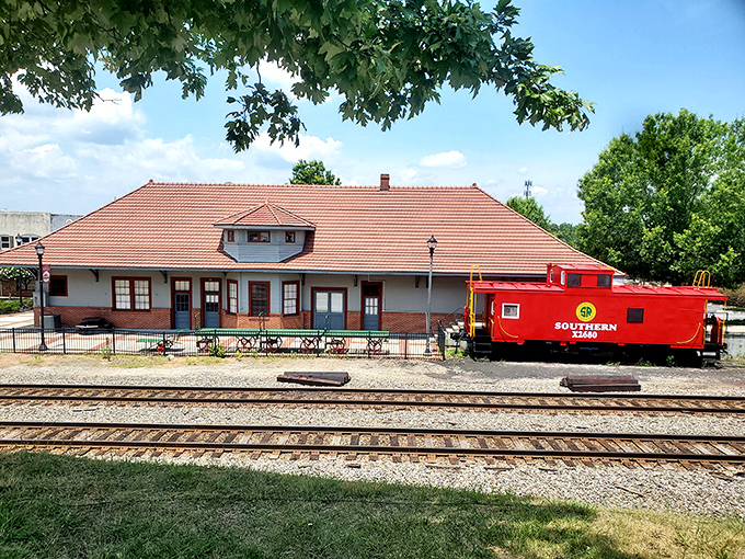 The vibrant red Southern Railway caboose perfectly complements the town's apple obsession&mdash;clearly, Cornelia has a favorite color.