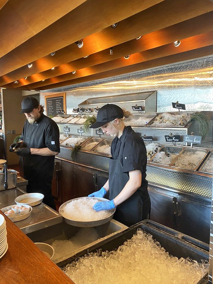 Behind the scenes, skilled staff prepare fresh oysters with the precision of surgeons and the pride of artists.