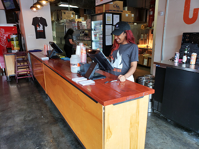 Behind every great hot chicken experience is a dedicated team member, ready to guide newcomers through their spicy journey.