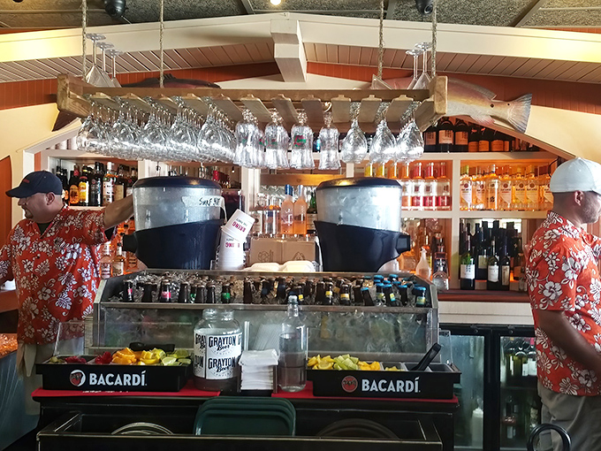 Behind every great beach drink is a bartender in a tropical shirt who knows exactly what your vacation self needs.