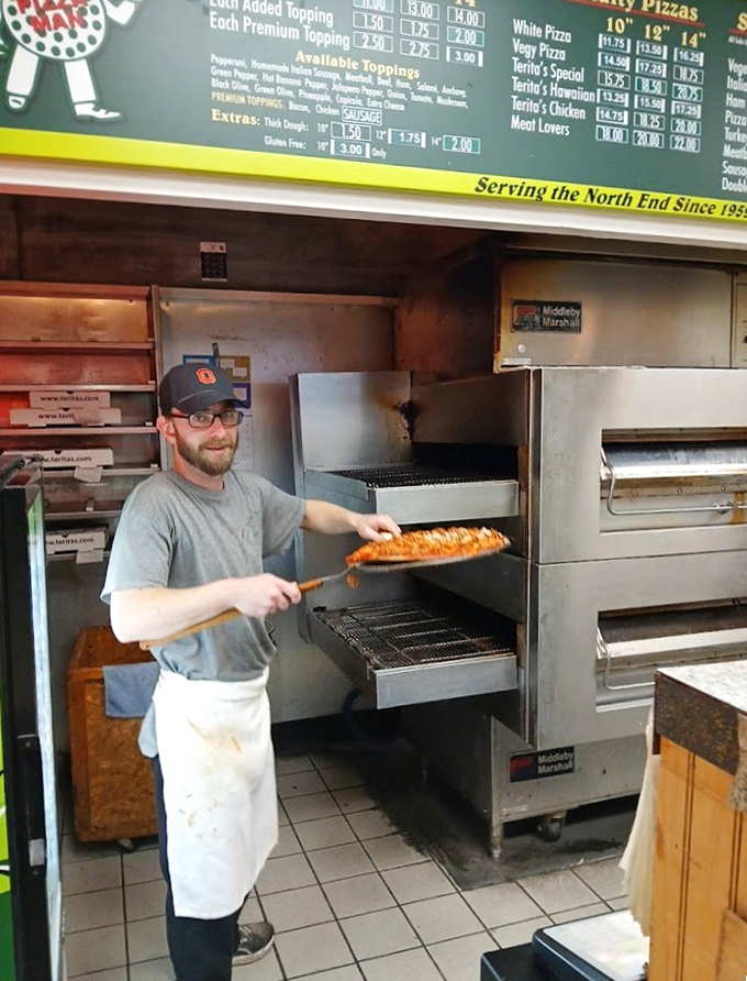 The pizza paddle dance&mdash;a skilled artisan at work. There's something hypnotic about watching someone who knows exactly what they're doing.