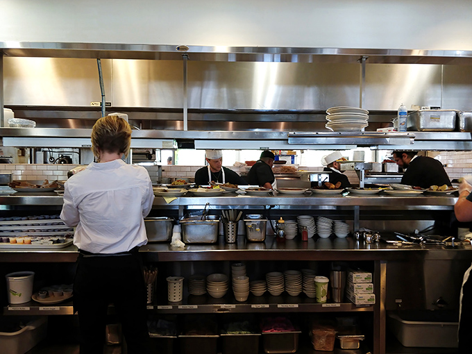 The pass-through window&mdash;where dreams become plates and the staff works with the precision of NASA engineers launching comfort food into orbit.