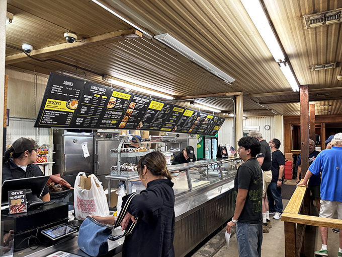 The line moves with practiced efficiency as customers contemplate life's most important question: brisket, sausage, ribs, or the correct answer &ndash; all three.