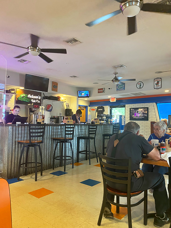 Where barbecue decisions are made and sauce-stained napkins accumulate. The orange and blue floor tiles whisper "Go Gators" with every step.