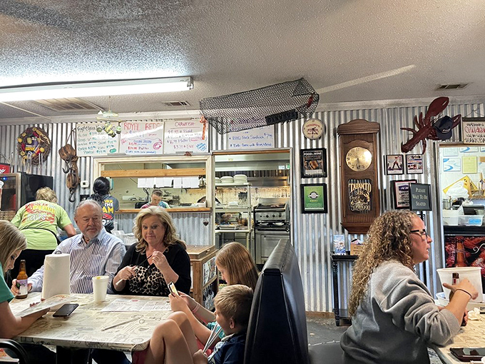 The dining room where strangers become friends over shared crawfish techniques and the mutual understanding that napkins are merely suggestions.