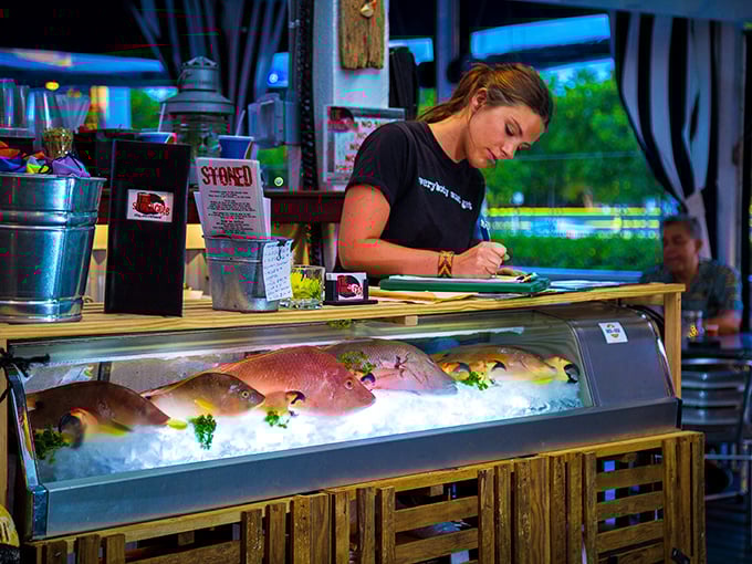 Fresh catch on display while staff prepares for the dinner rush—a behind-the-scenes glimpse of seafood stardom in the making.