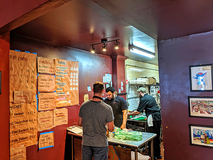 The staff works with the focused intensity of artists, each plate a canvas for their smoky masterpieces.