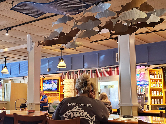 Fish sculptures swimming across the ceiling – because when the food's this good, even the décor wants to dive in.