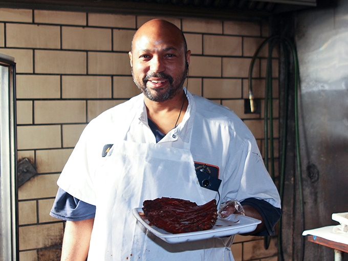 Behind every great barbecue is someone who understands the sacred relationship between meat, smoke, and patience.