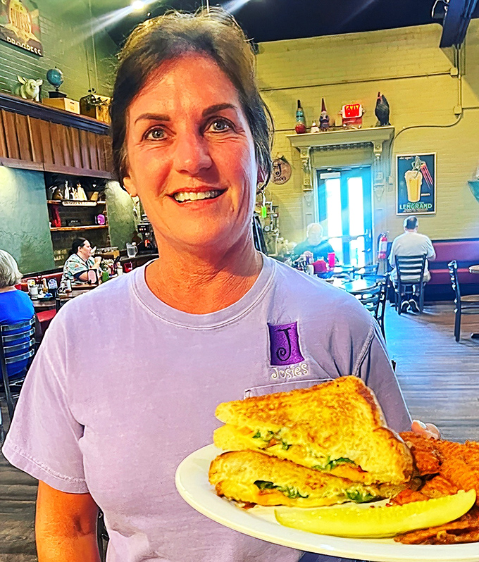 The smile says it all: when your server looks this happy to bring you a sandwich, you know you've chosen the right breakfast spot.