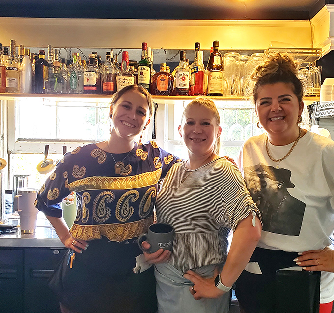 The staff who transform ingredients into memories. Their smiles suggest they know exactly how good their food is.