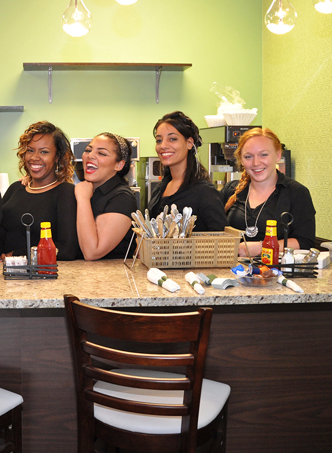 These smiling staff members understand that delivering pancake happiness is basically performing a public service every single morning.