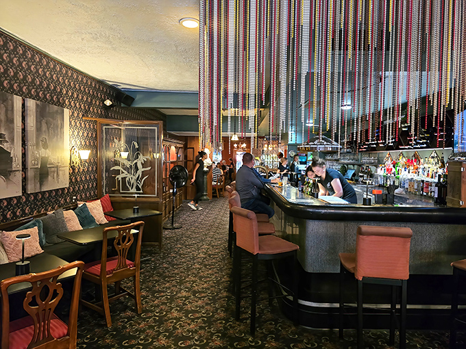 Those beaded curtains and pink bar stools aren't just decor&mdash;they're time portals to when The Rat Pack might drop in for dinner.