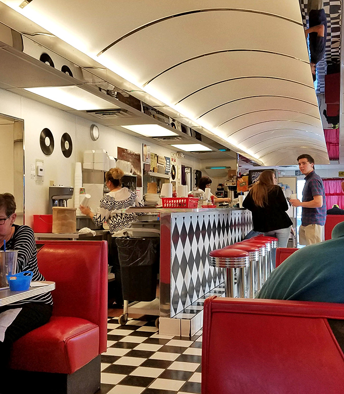 A symphony in black and white tiles with splashes of red &ndash; the counter view offers front-row seats to short-order culinary theater.