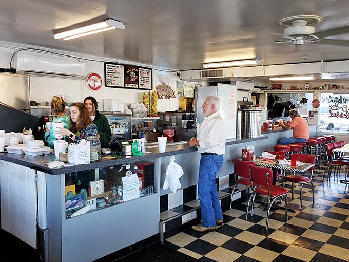 The dining area hums with conversation and clinking silverware, while staff members orchestrate the beautiful chaos of feeding hungry patrons.