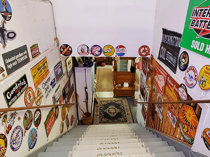 That stairway lined with vintage signs leads to the second floor of "I didn't know I needed this."