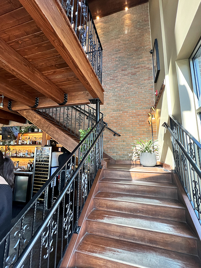 These aren't just stairs; they're an invitation to discover what culinary delights await on the second floor. The wrought iron details add old-world charm.