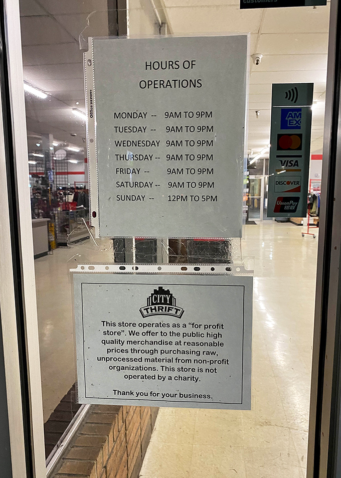 The hours of operation sign reveals the thrifter's schedule&mdash;generous windows of opportunity for treasure hunting almost every day.
