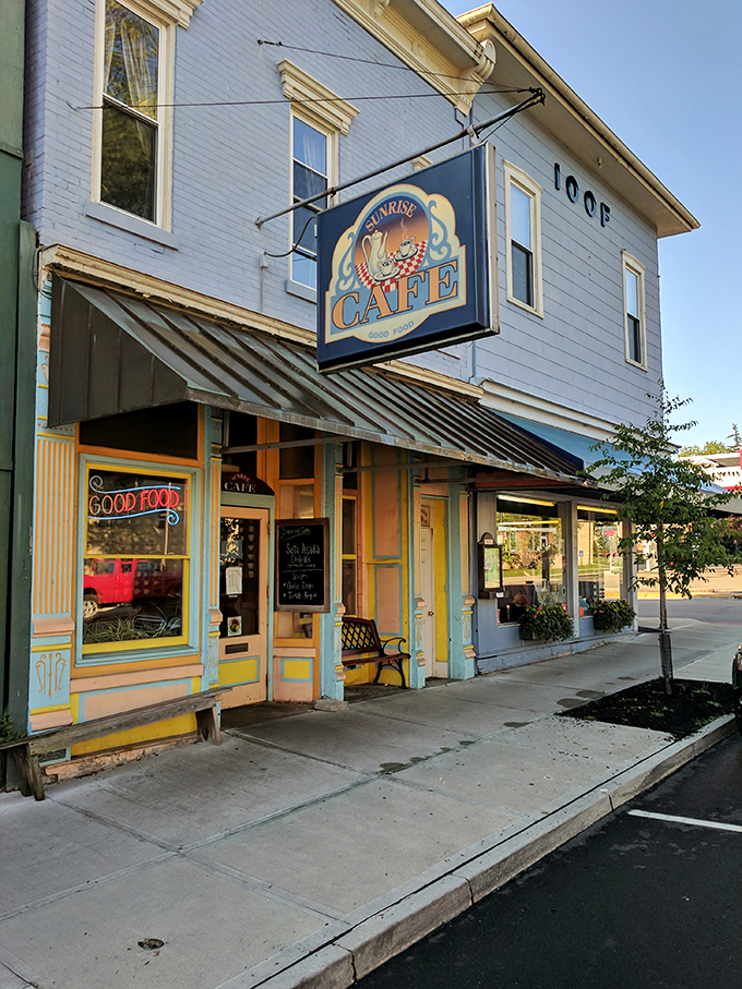The Sunrise Cafe's cheerful exterior promises morning delights. That "GOOD FOOD" sign isn't just advertising&mdash;it's a solemn vow to your taste buds.