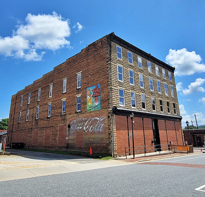 This historic building wears its age with dignity, the faded Coca-Cola ghost sign a reminder of simpler times and enduring American brands.