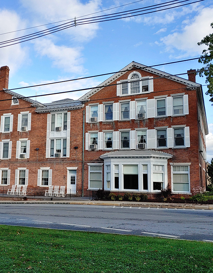 The Middlebury Inn stands as a brick testament to hospitality traditions that predate online reviews and star ratings.