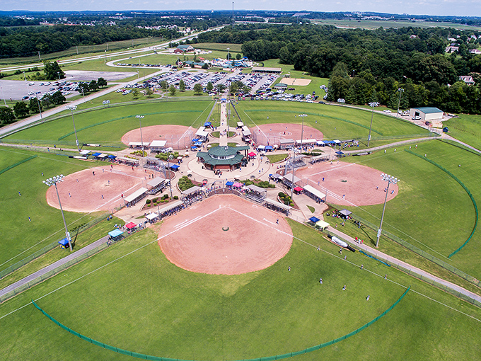 Multiple baseball diamonds spread out like someone planned the perfect retirement schedule: watching games without mortgage-sized ticket prices.