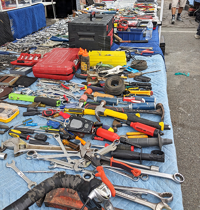 A mechanic's dream spread across blue canvas. Each tool represents a problem solved, a project completed, a weekend warrior's arsenal.