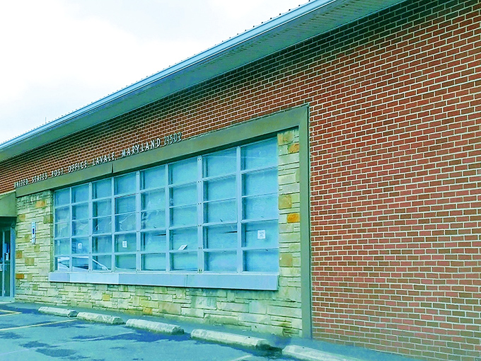 The U.S. Postal Service building blends brick and stone in that distinctly American architectural style that says, "Your tax dollars built something substantial."