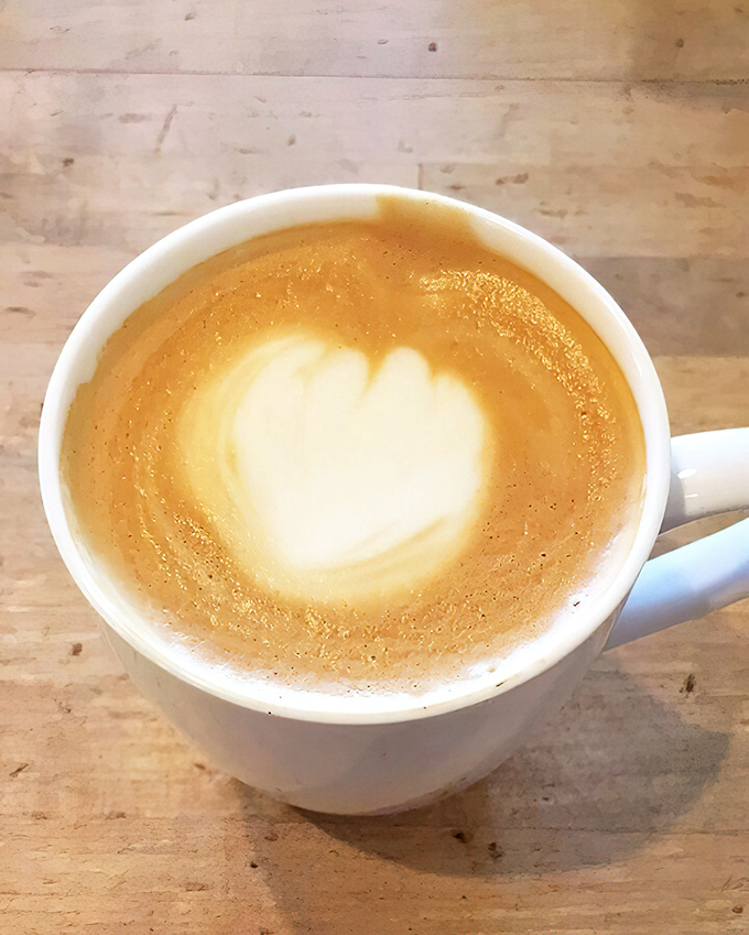 A latte with a heart that says, "I was made with care by someone who understands morning caffeine is actually liquid love."