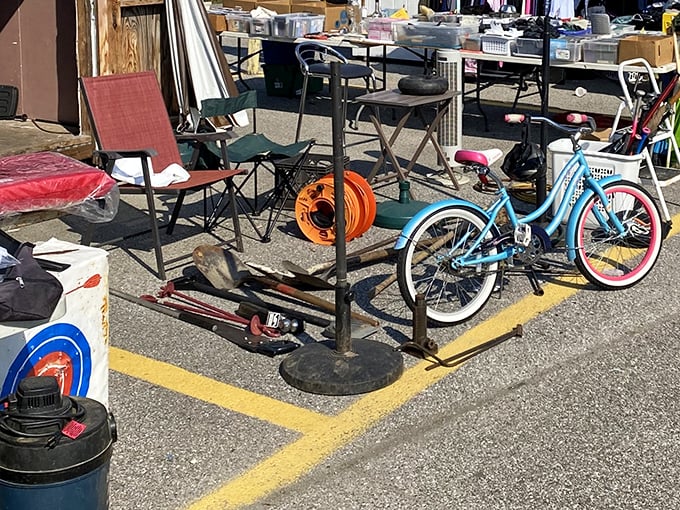 One person's castoffs become another's vintage finds. This eclectic collection of chairs, bikes, and gadgets awaits its second chance at usefulness.