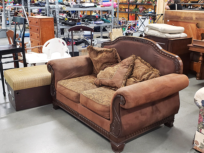 This isn't just a sofa&mdash;it's a statement piece with enough ornate detailing to star in its own period drama. Victorian elegance meets Oklahoma practicality.