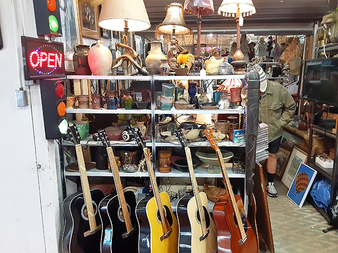 Musical instruments and curiosities coexist in perfect harmony. That guitar might have once played a song that changed someone's life.