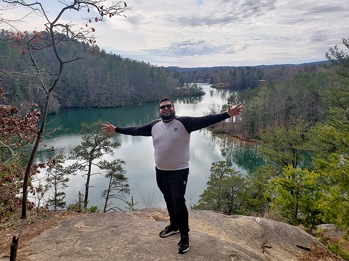 The universal "I conquered the mountain" pose never gets old. Some views simply demand outstretched arms and an ear-to-ear grin.