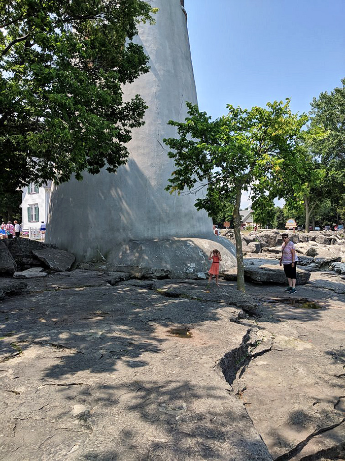 The lighthouse's base showcases Marblehead's famous limestone foundation, where visitors can literally stand on 400-million-year-old fossilized sea creatures.