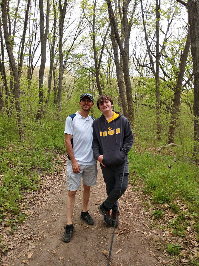 Hiking companions share a moment on the trail, proving that nature's best experiences are even better when shared.
