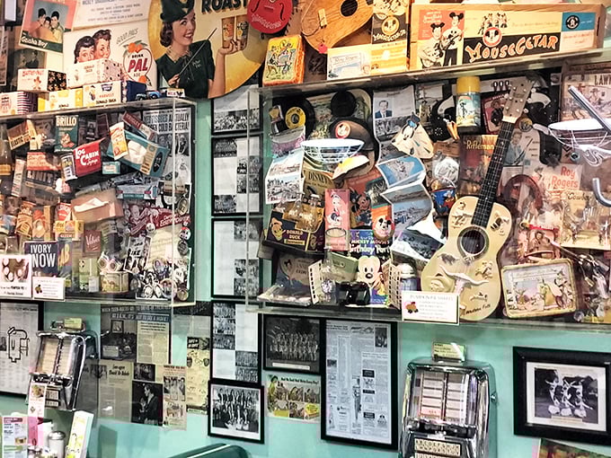 This isn't decoration; it's documentation &ndash; a visual history of American pop culture where Mickey Mouse hangs out with Elvis memorabilia in perfect harmony.