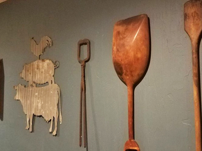 Farm tools as d&eacute;cor isn't just aesthetic&mdash;it's a reminder that great food begins with the land. Those wooden paddles have stories to tell.